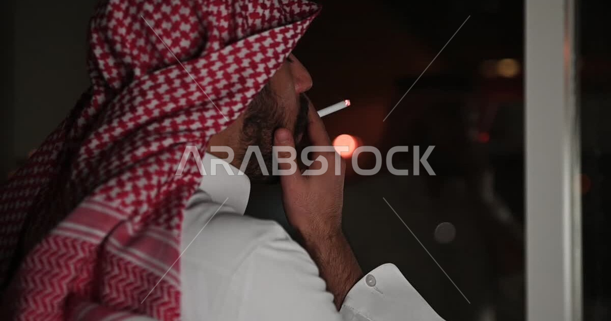 A young Saudi Arab smokes cigarettes, tobacco addiction, cigarette ...