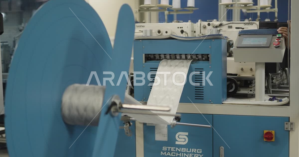 Advanced industrial machines, a close-up of the machines during weaving ...