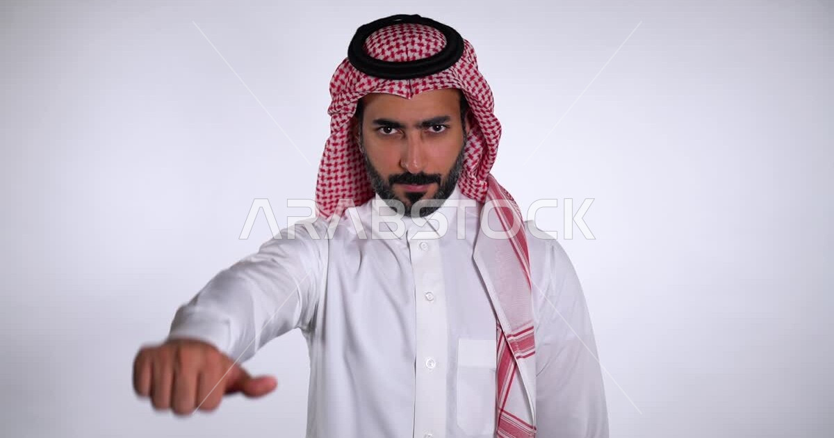 Portrait of a Saudi Gulf man angry and frowning with different face and ...