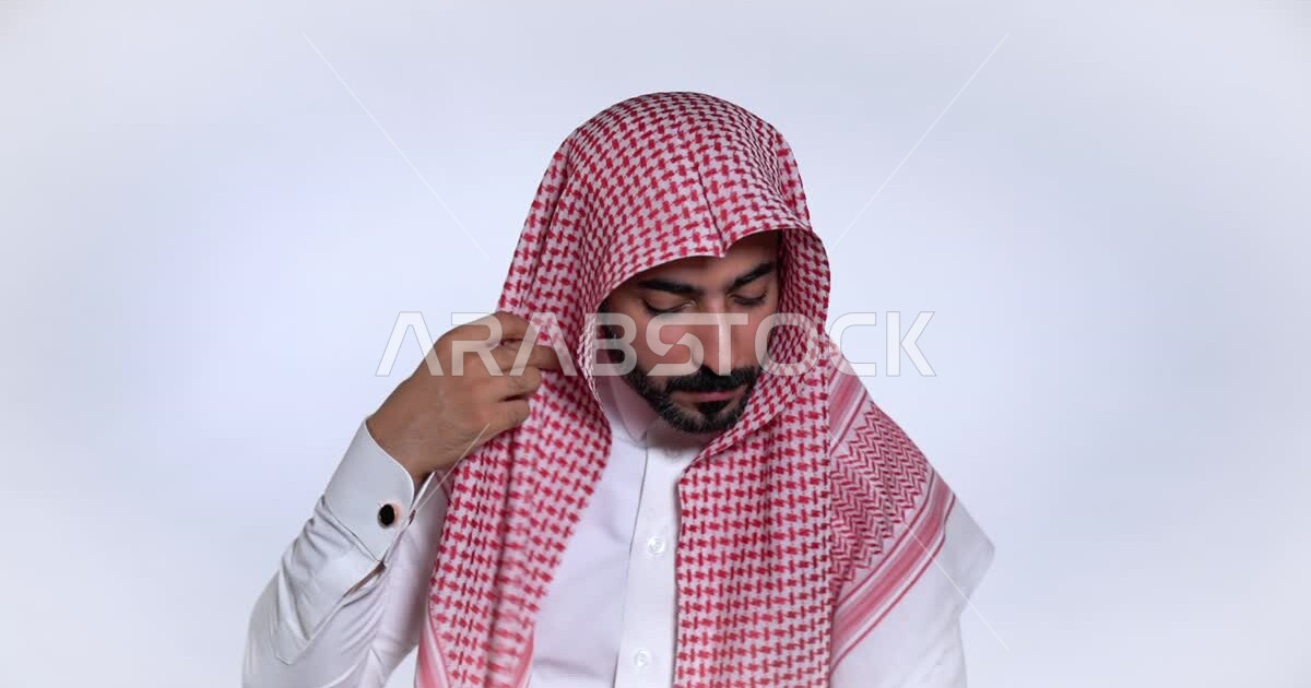 Portrait of a sad Saudi Gulf man, wearing a shemagh, facial expressions ...
