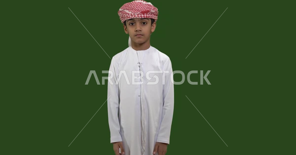 Muscle and joint inflammation, an Arab Gulf Emirati boy wearing a ...