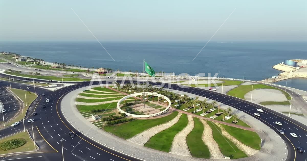 Waterfront, towers, skyscrapers and hotels, aerial view of Saudi flag ...