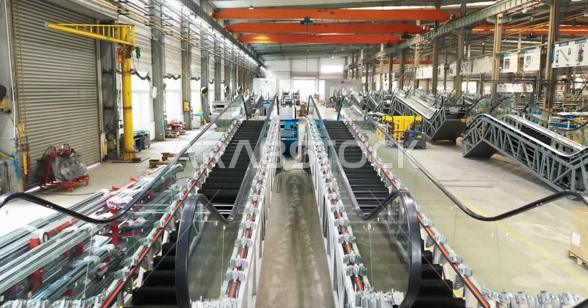 Elevator factory, close-up of a group of escalators inside a factory ...