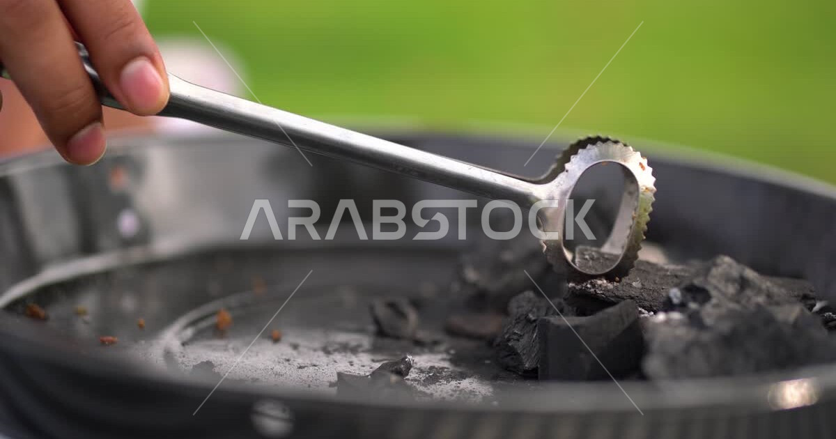 A group of burning coals inside a fire pit on a trip, special family ...