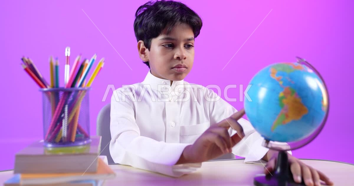 Looking at a globe with gestures of integration and concentration ...