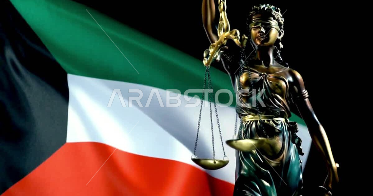 A statue of Lady Justice in front of the waving flag of the State of ...