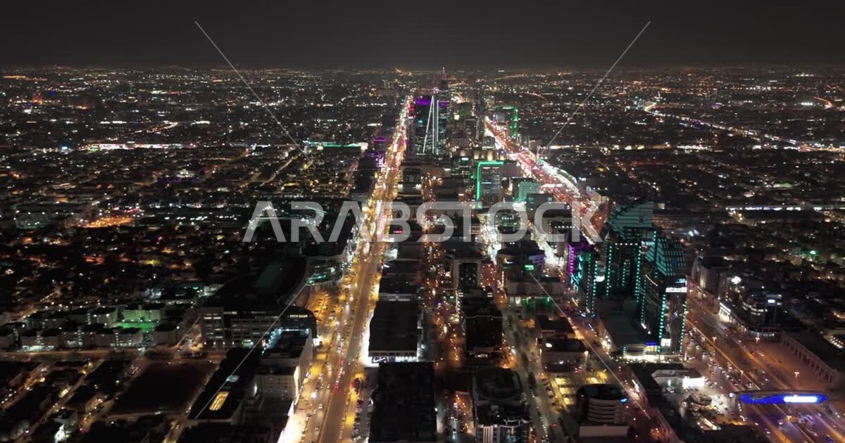 Urban growth and progress, close-up of illuminated Kingdom Tower in ...