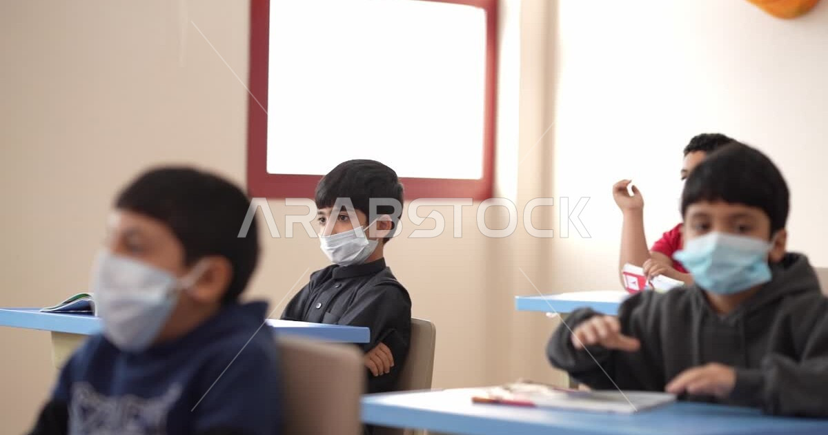 A group of Saudi Arabian Gulf students sitting in their seats inside ...