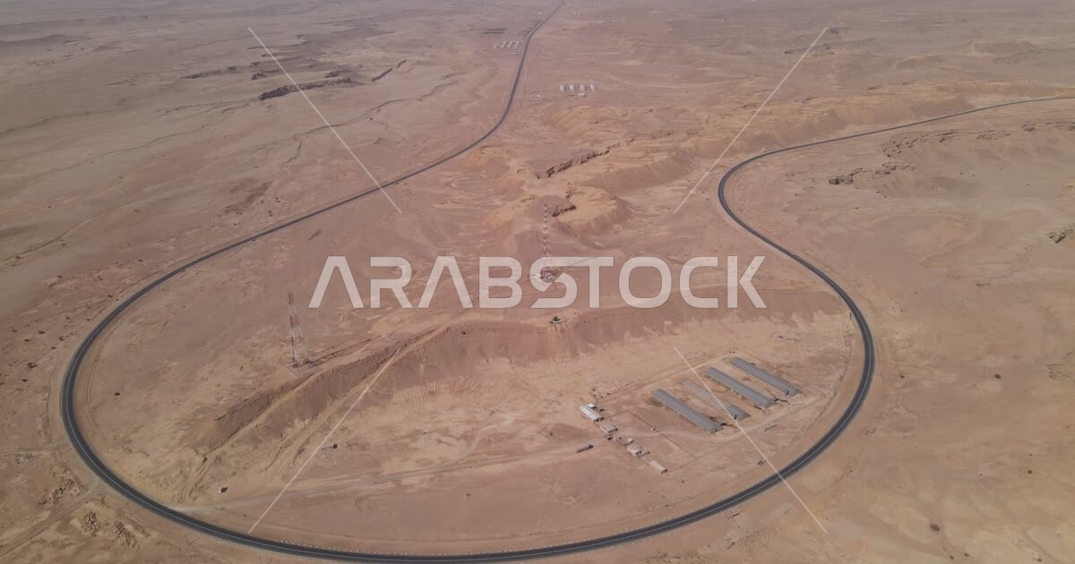 Soft sand dunes and hills, golden sand in desert areas, paved road ...