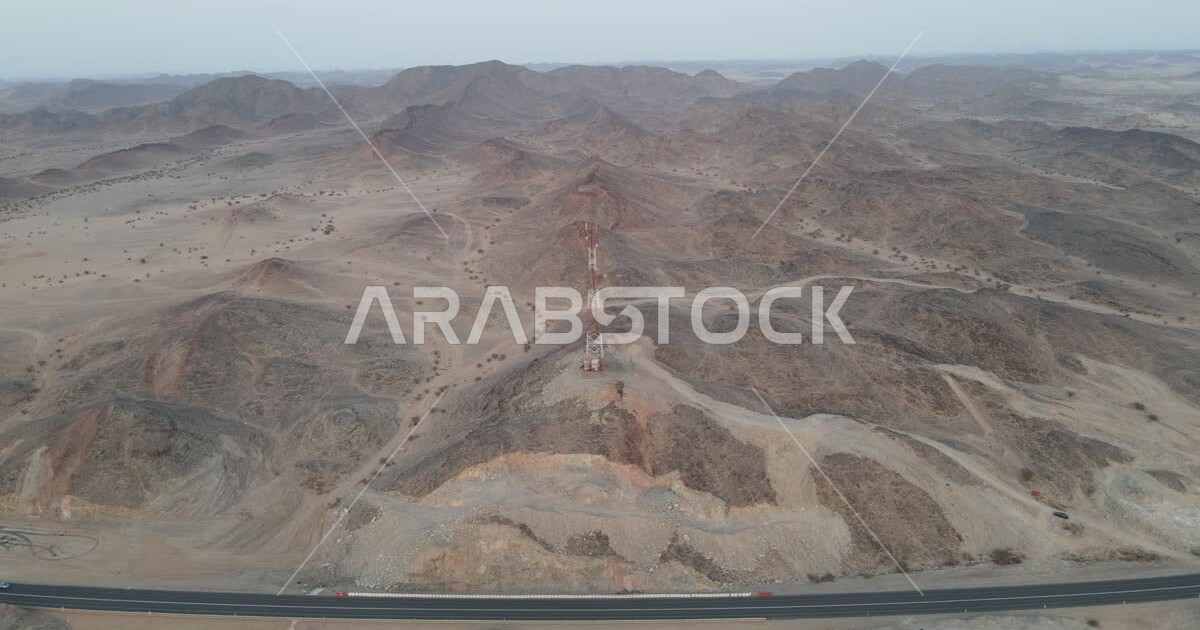 Soft sand dunes and hills, golden sand in desert areas, paved road ...