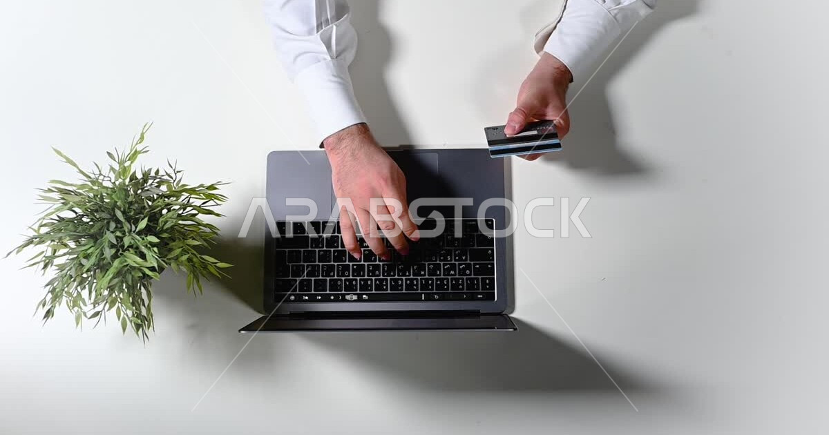 Close-up photo from the top, of a Saudi Arabian man entering bank ...