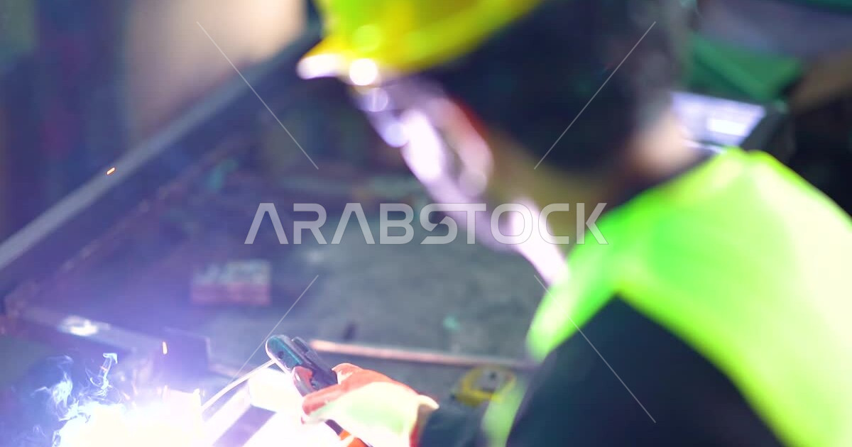 Two Saudi engineers working inside the factory in the Kingdom of Saudi ...
