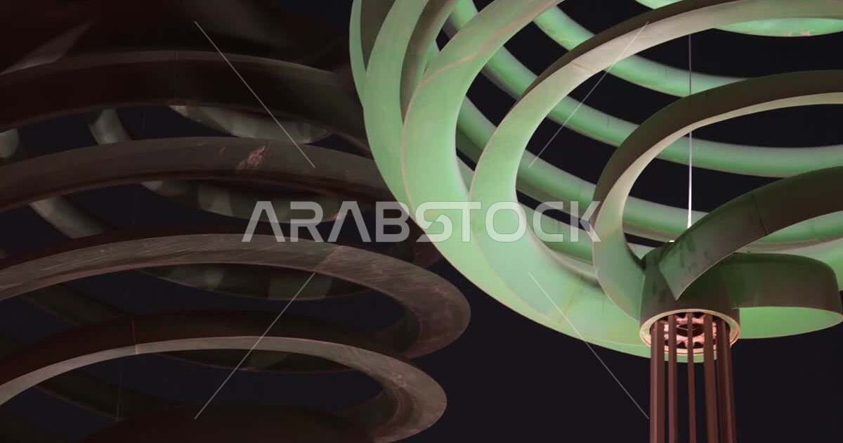 Illuminated art sculptures in the form of green trees at night in Arqa ...