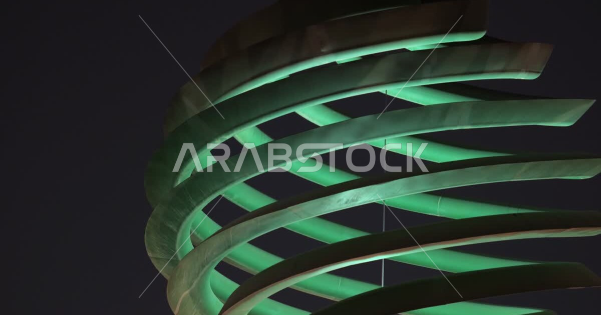 Illuminated art sculptures in the form of green trees at night in Arqa ...