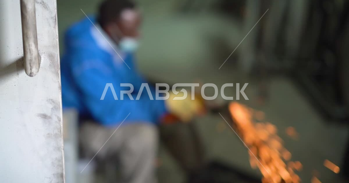 Two Saudi engineers working inside the factory in the Kingdom of Saudi ...