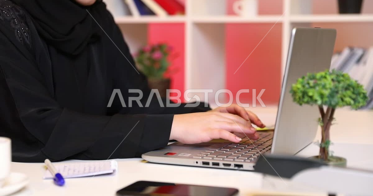 A close-up picture of a Saudi-Gulf business woman working at the ...