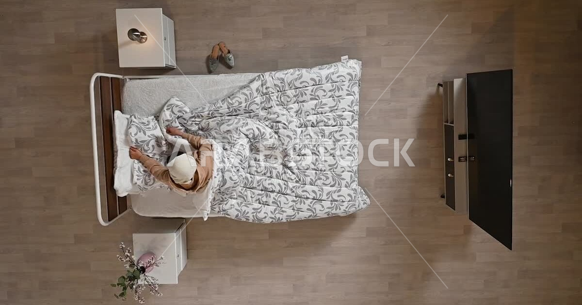 Relaxing and resting during nap time, vertical top view of a veiled ...