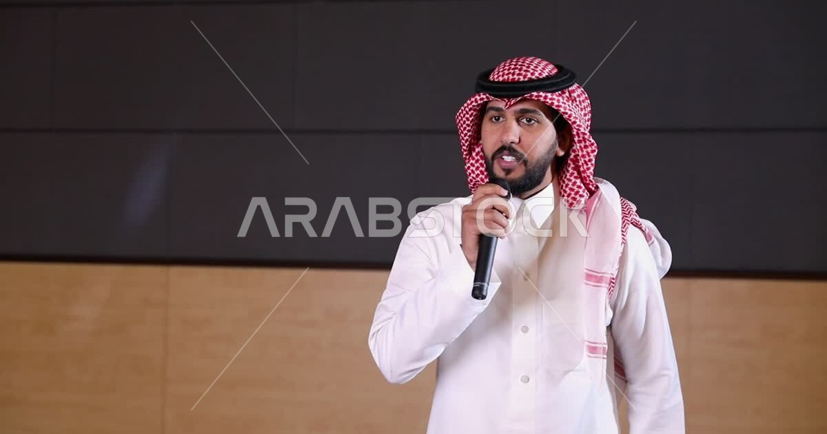 A Saudi Gulf theater presenter on stage, presenting theatrical ...