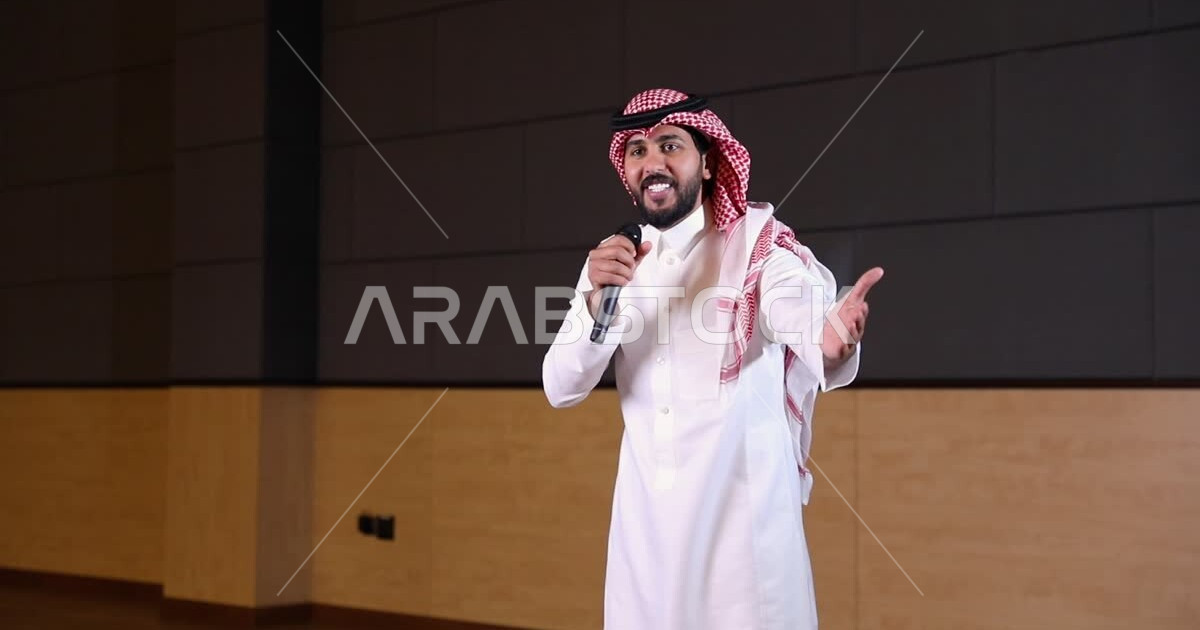 A Saudi Gulf theater presenter on stage, presenting theatrical ...