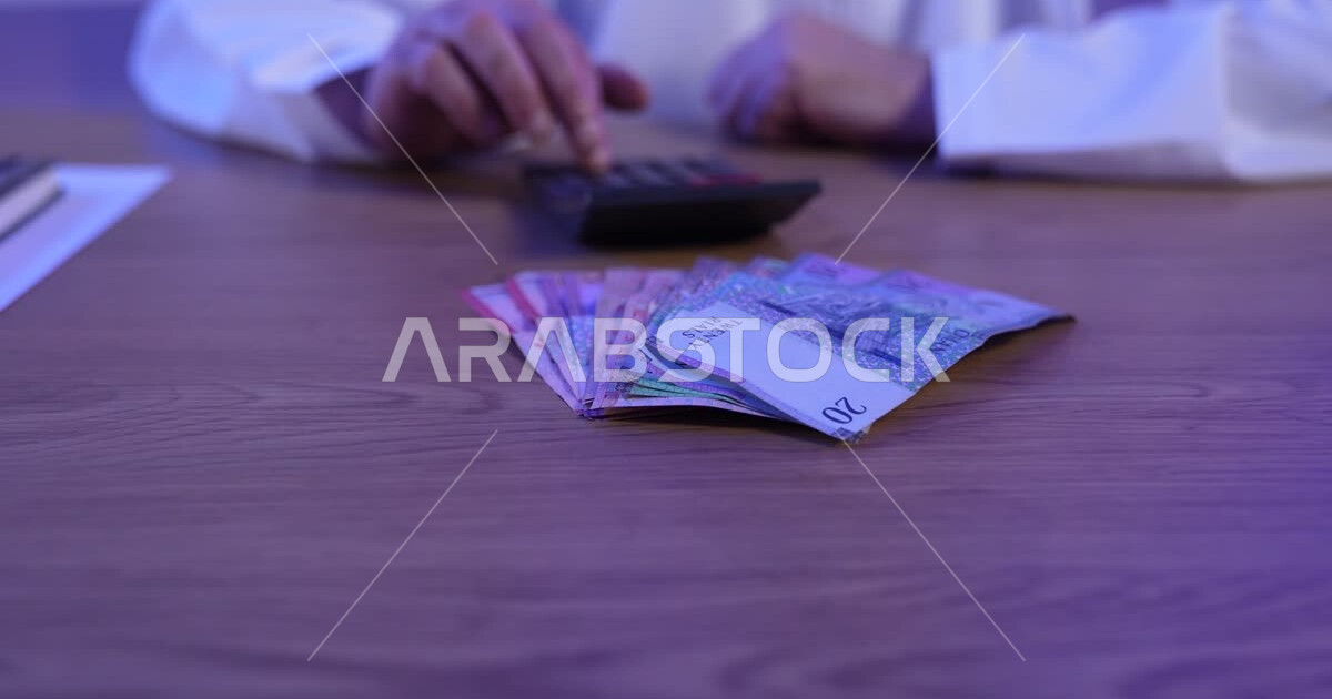 Performing important financial calculations and counting money on a ...