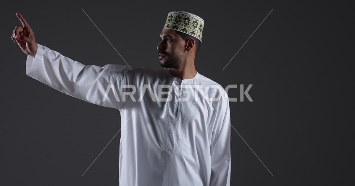 Raising the hands up with oath gestures, a picture of a young Arab Gulf ...