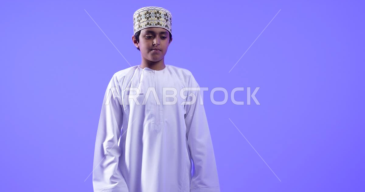 Greeting, welcoming and receiving someone, an Arab Gulf Omani boy ...