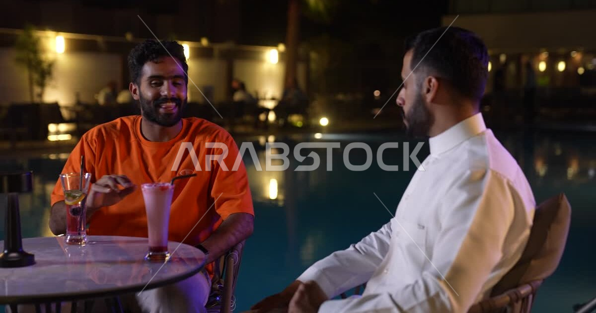 Entertainment and fun with friends, close-up of two young Omani Arab ...