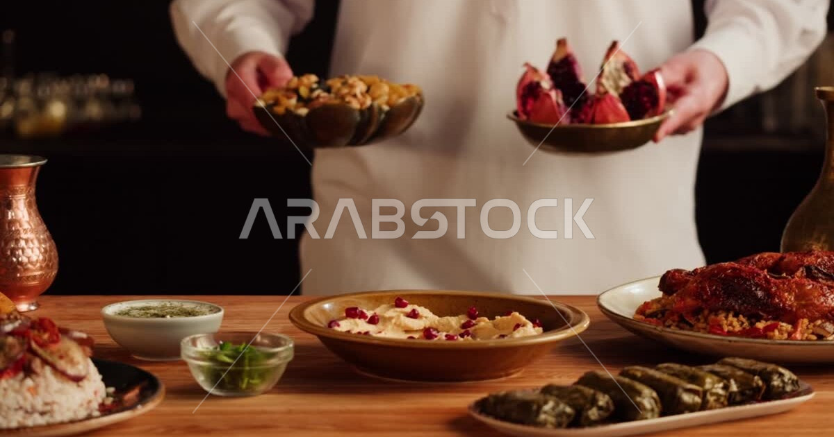 Preparing and setting up a table full of popular foods and recipes, a ...