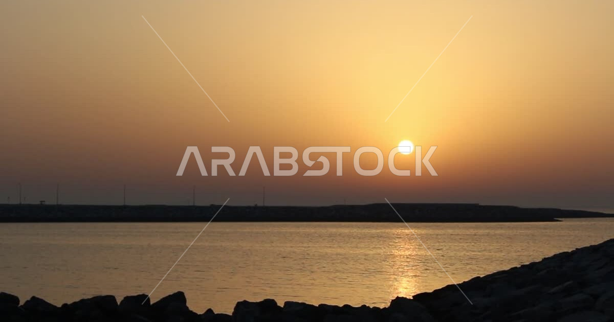 Sunset and sunrise on the shore of the Red Sea in the city of Jeddah, a ...