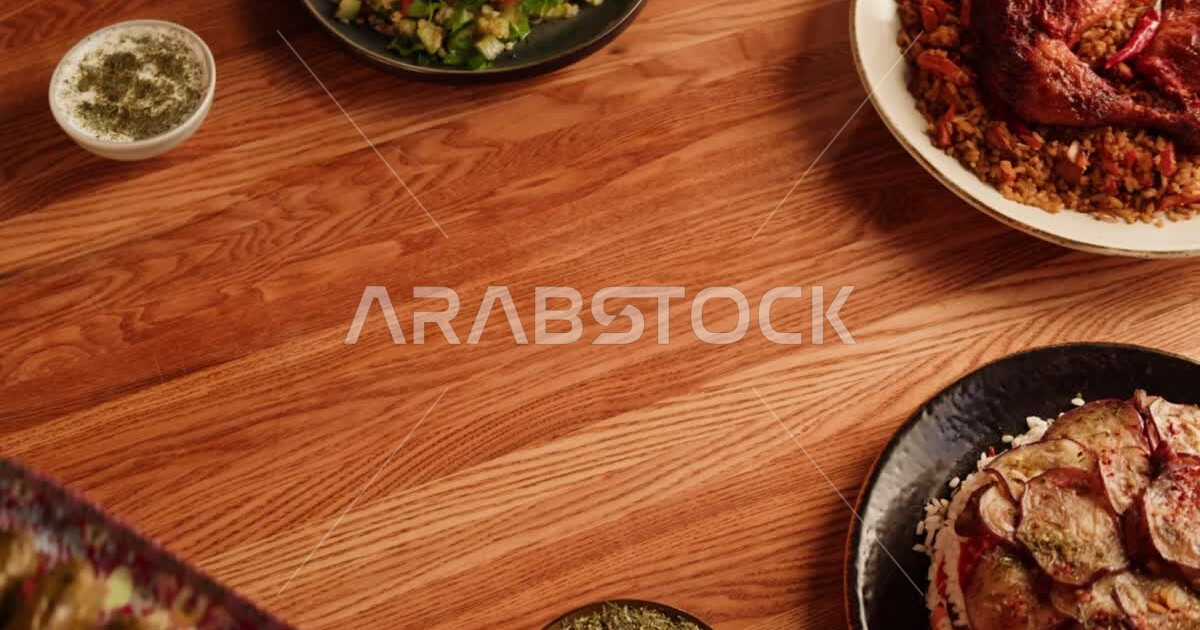 A table full of Arabic appetizers and mutabbal decorated with ...