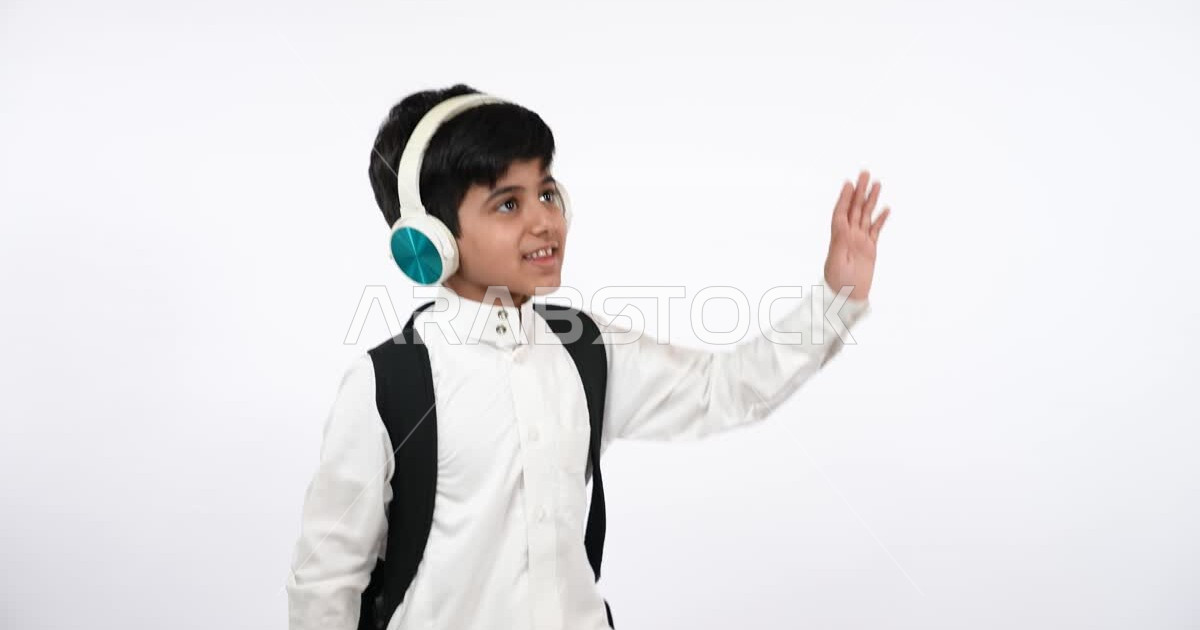 Portrait of a happy Saudi Arabian Gulf Arab student, wearing a school ...