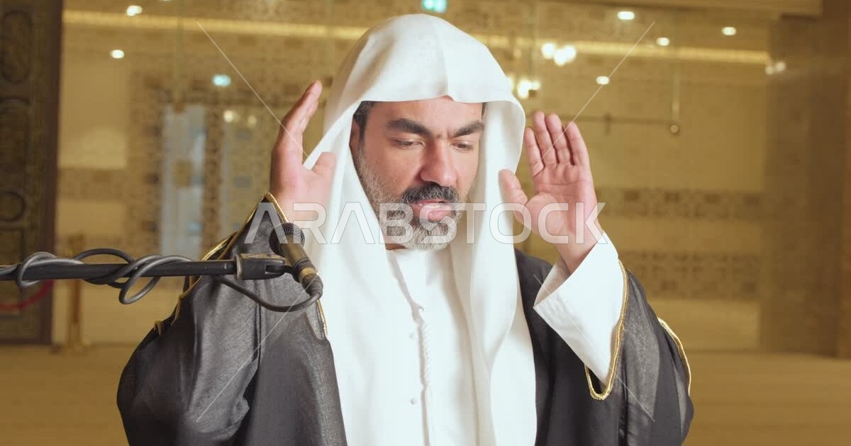 Performing Islamic religious duties, leading the Muslim congregation in ...