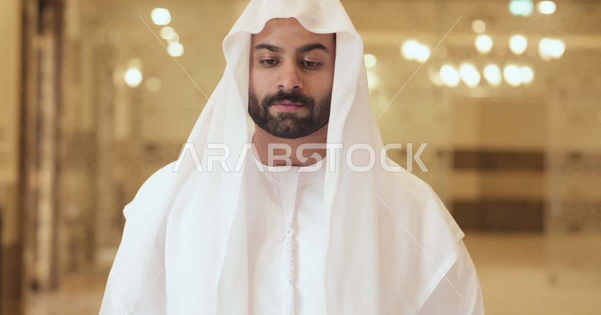 Worship and getting closer to Allah Almighty, a close-up of an Emirati ...