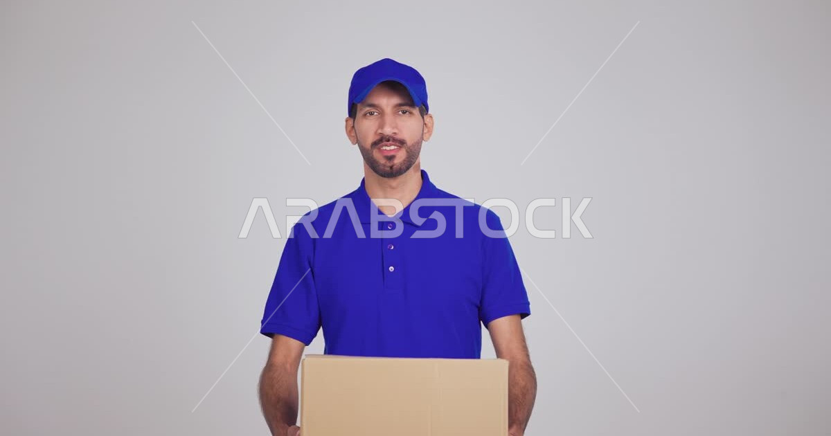 Young Saudi Arabian Gulf man working on delivering orders, receiving ...