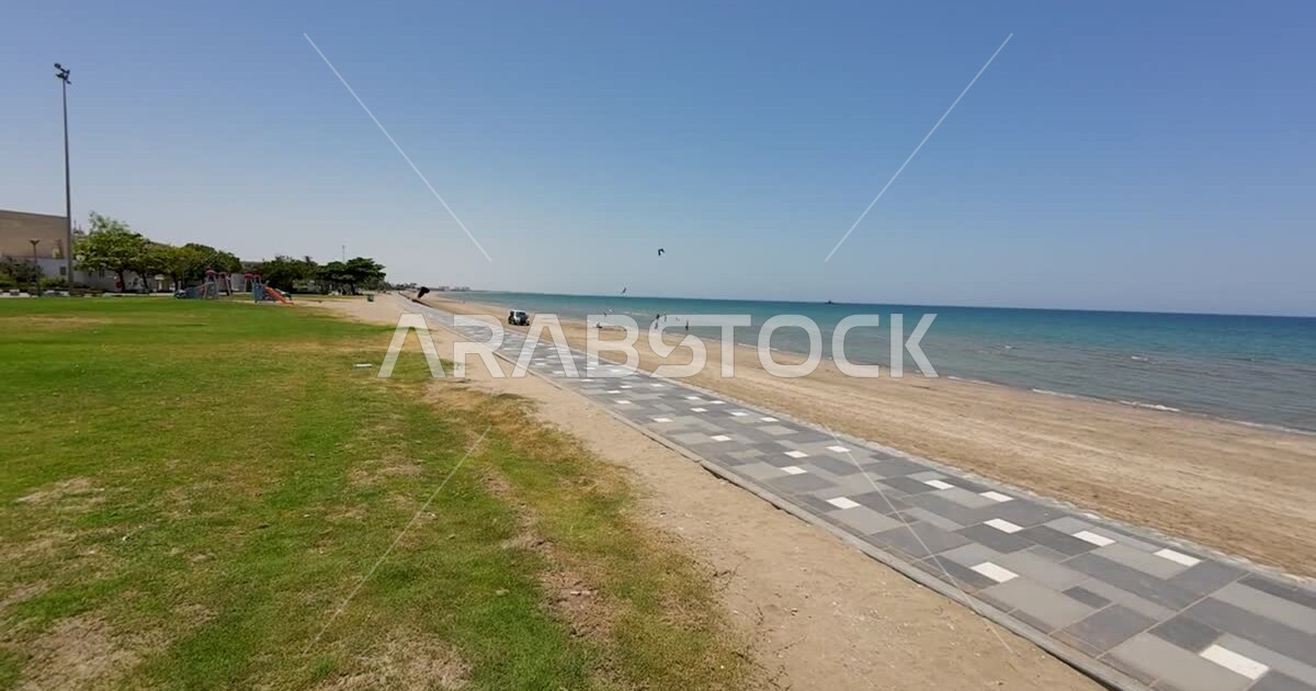 Police car driving on the golden beach in Muscat, distinguished coastal ...