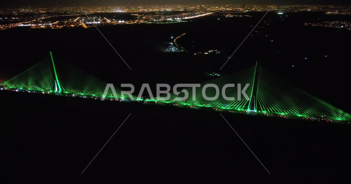 Night aerial photography of the Riyadh suspension bridge supported by ...