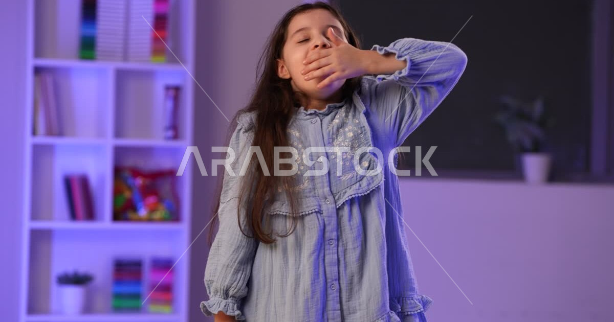 Feeling tired, lazy and lethargic, a cute Emirati Gulf Arab girl ...