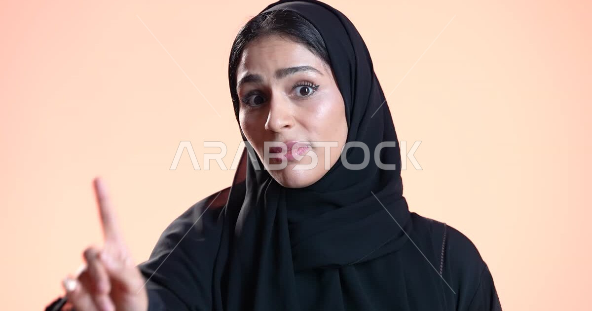 Determining a specific location with cheerful gestures, a young Emirati ...