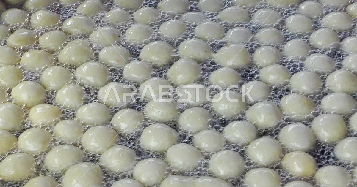 Delicious golden Luqaimat dessert, oriental Zalabiyat dessert, close-up ...
