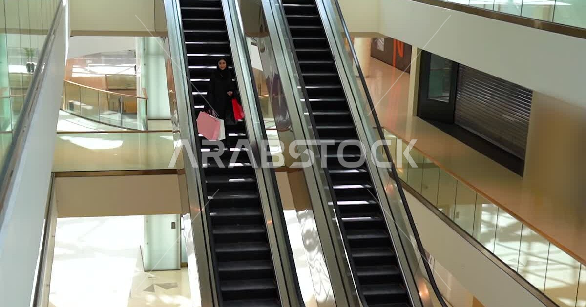 A Saudi-Gulf Arab woman who uses the electric stairs, the ease of using ...