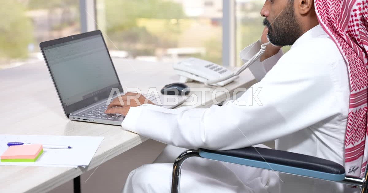A Saudi Arabian Gulf employee of people of determination works on a ...