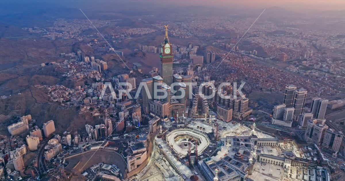 Clock tower and surrounding skyscrapers, famous Islamic religious ...