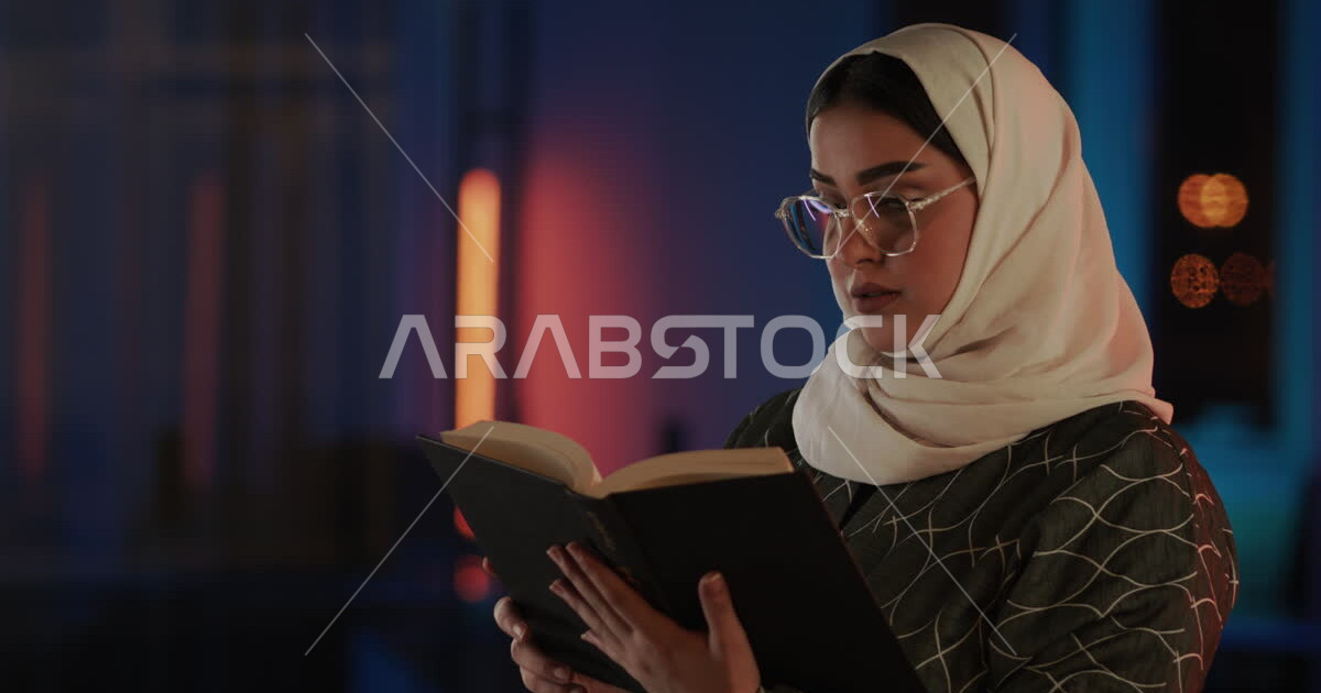 A veiled and educated Gulf Saudi Arabian woman, doing a photo session ...
