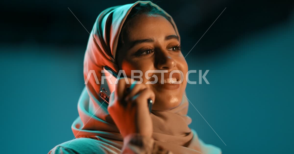 A Saudi Arabian Gulf woman, a photo session with colored lighting ...