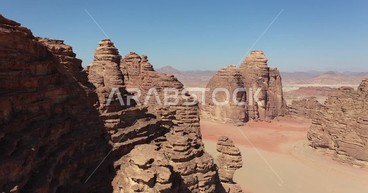 Drone photography of the towering mountains and rock formations in the ...