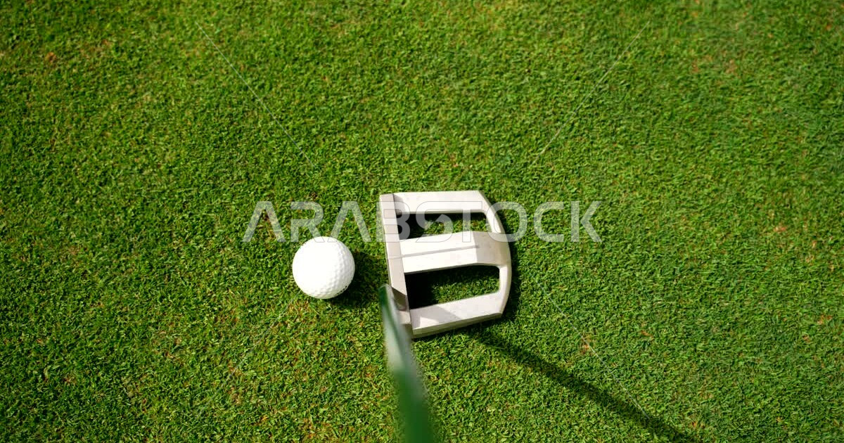 Close-up of a golf putter hitting the ball to hit the target, golf ...