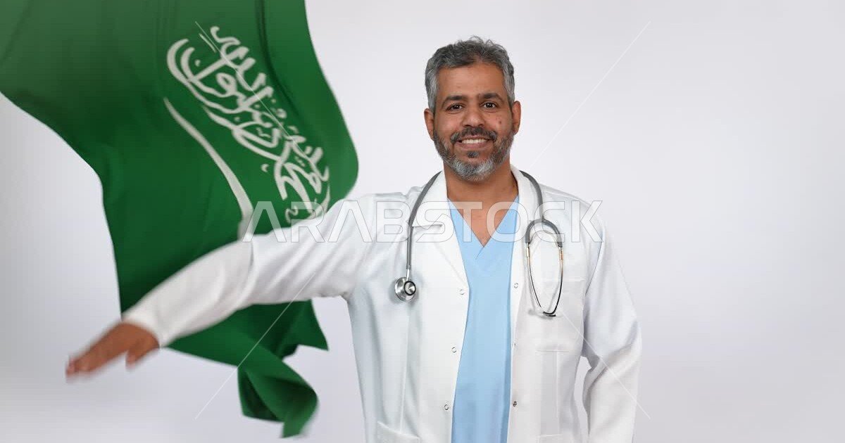 Portrait of a Saudi Arabian Gulf doctor, behind him is the flag of the ...