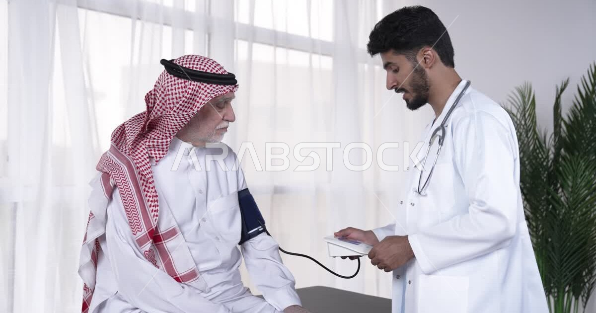 Portrait of a Saudi Arabian Gulf doctor checking the blood pressure of ...
