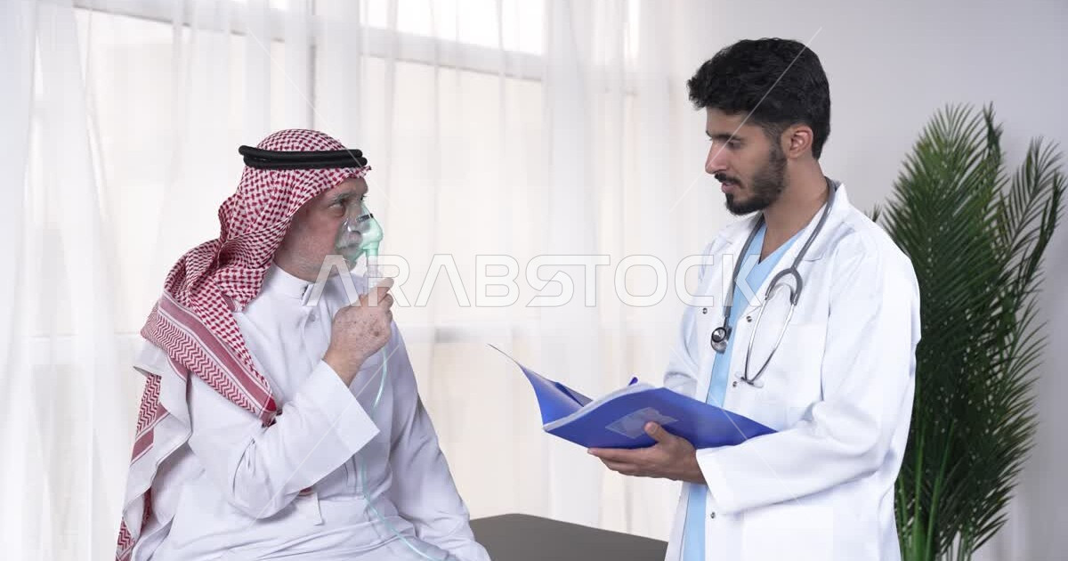 A Saudi Arabian Gulf patient who has breathing problems, puts an oxygen ...