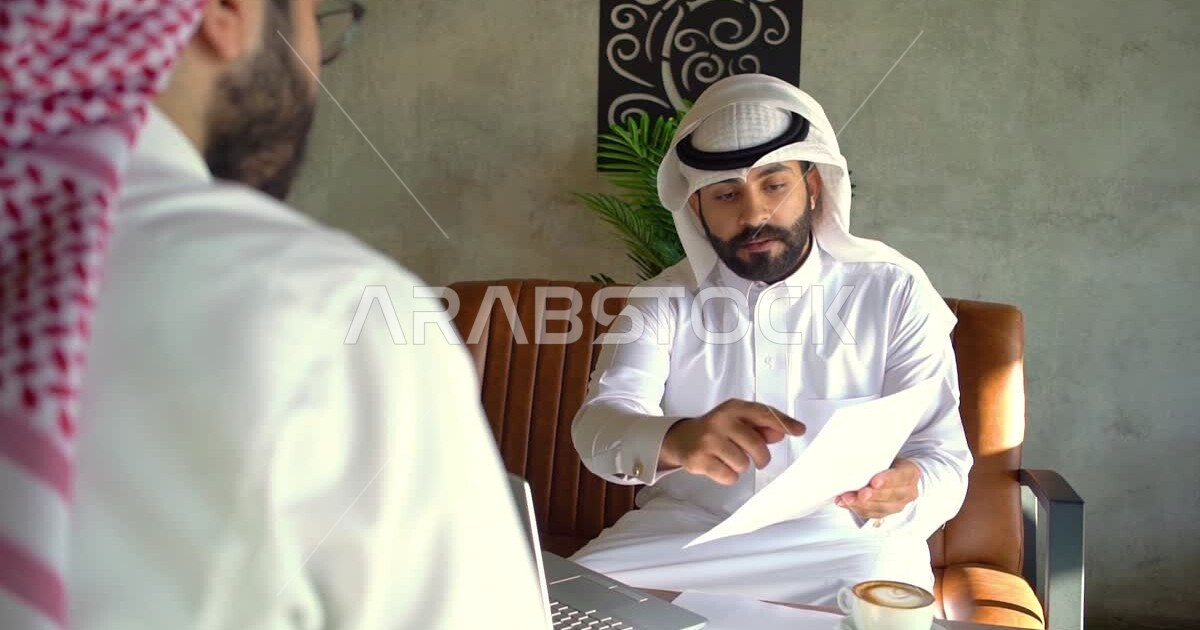Meeting of Saudi-Arab Gulf co-workers at their workplace, discussing ...